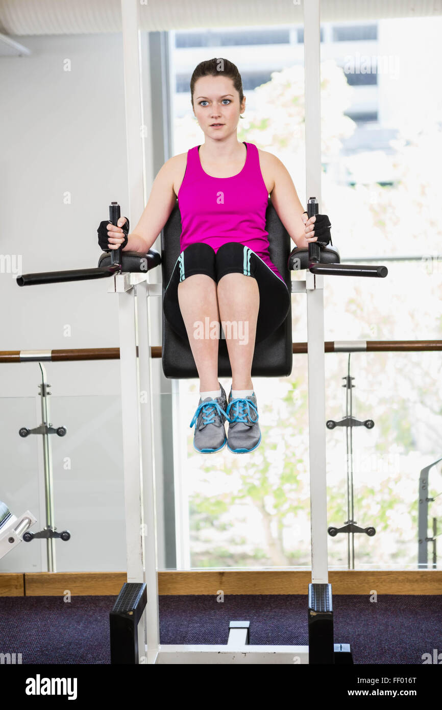 Fit woman doing pull up Stock Photo - Alamy