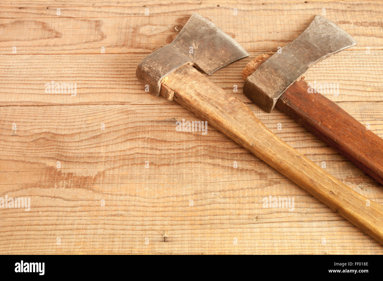 Two dated and used cleavers on wooden background Stock Photo - Alamy