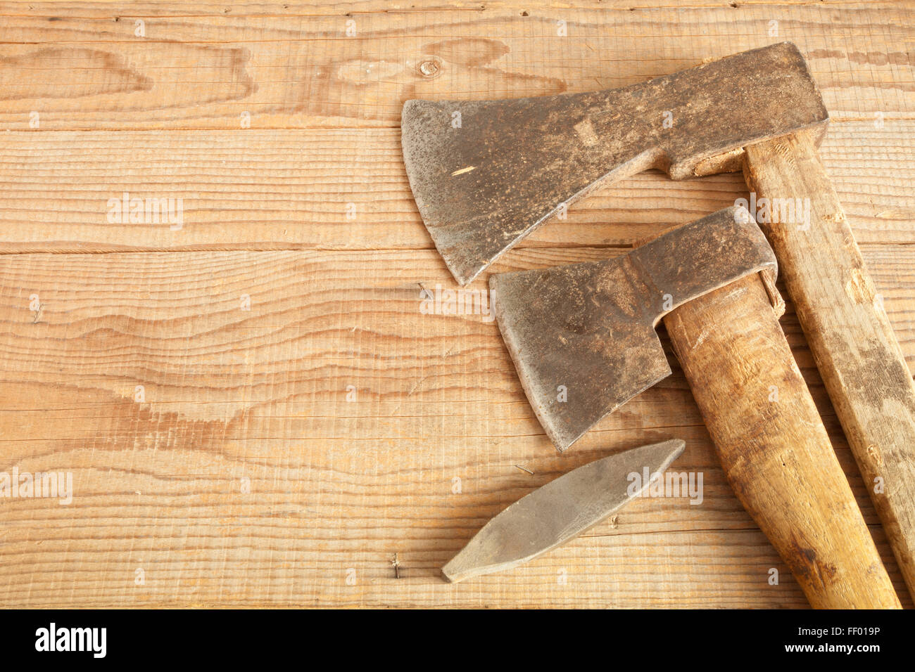 Two dated and used cleavers on wooden background Stock Photo - Alamy