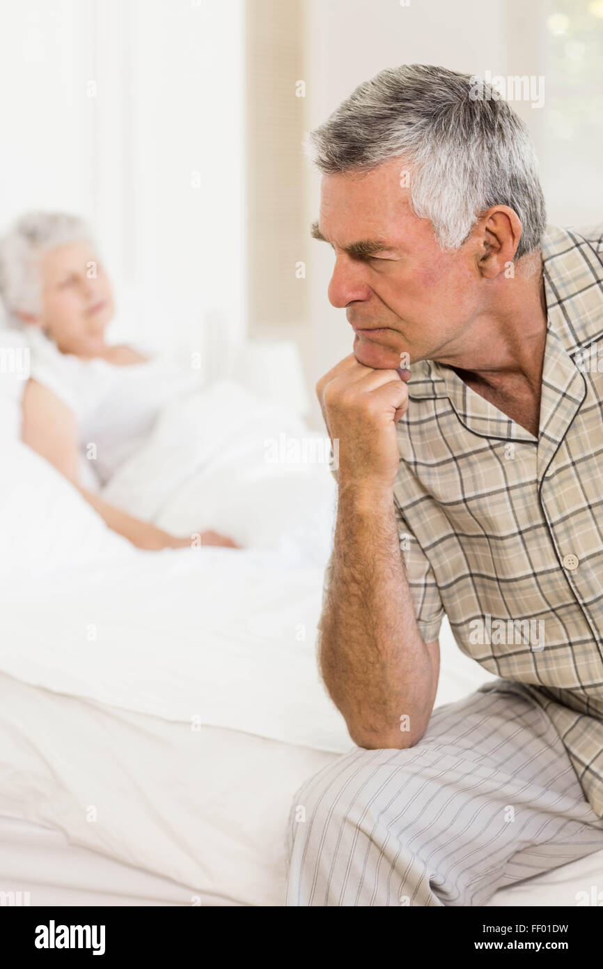 Serious senior man thinking Stock Photo - Alamy