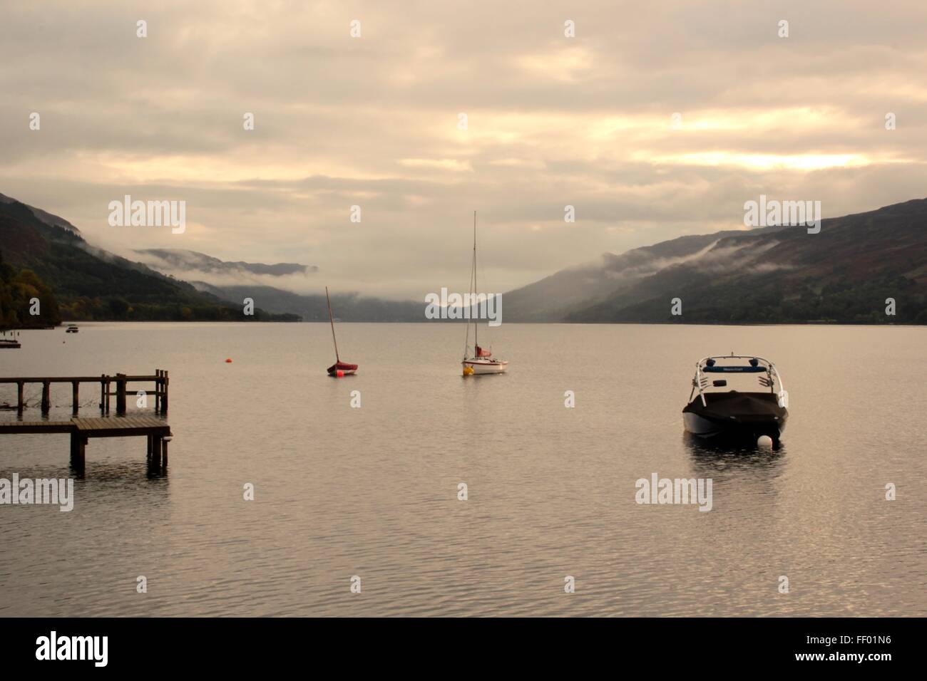Boats dot the water of loch earn in a fog Stock Photo - Alamy
