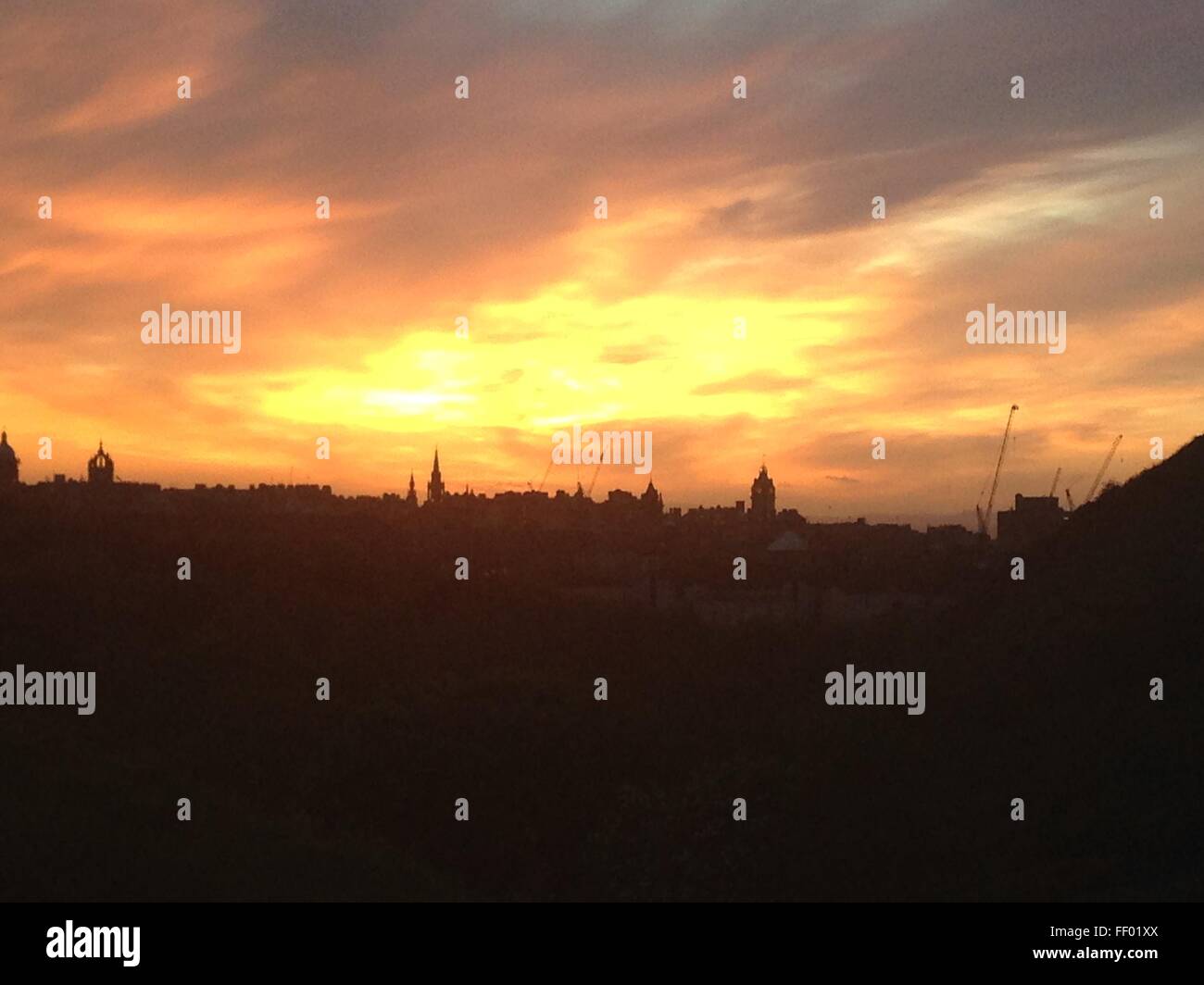 Sunrise over Edinburgh with beautiful clouds Stock Photo - Alamy