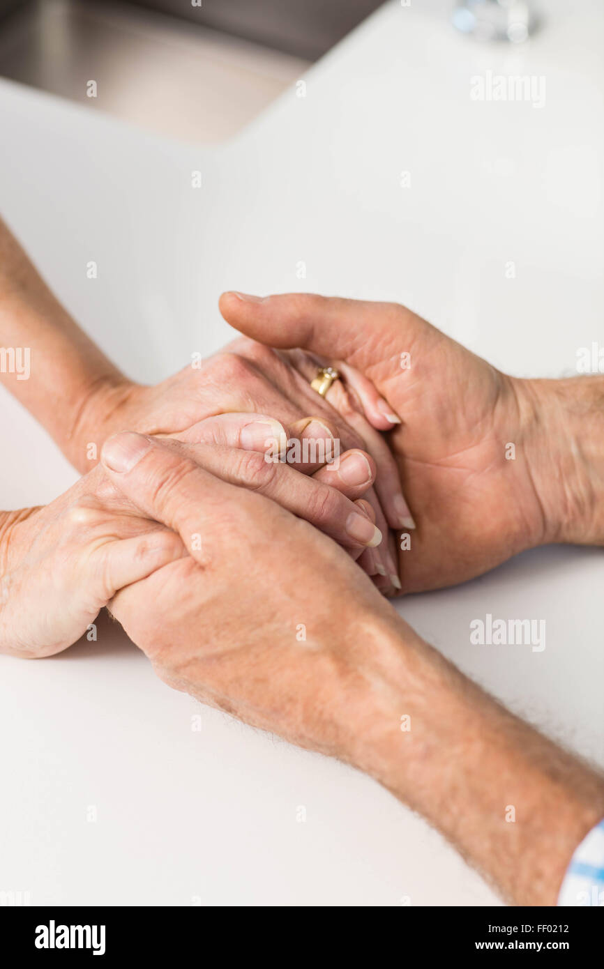 Seniors hands together Stock Photo - Alamy
