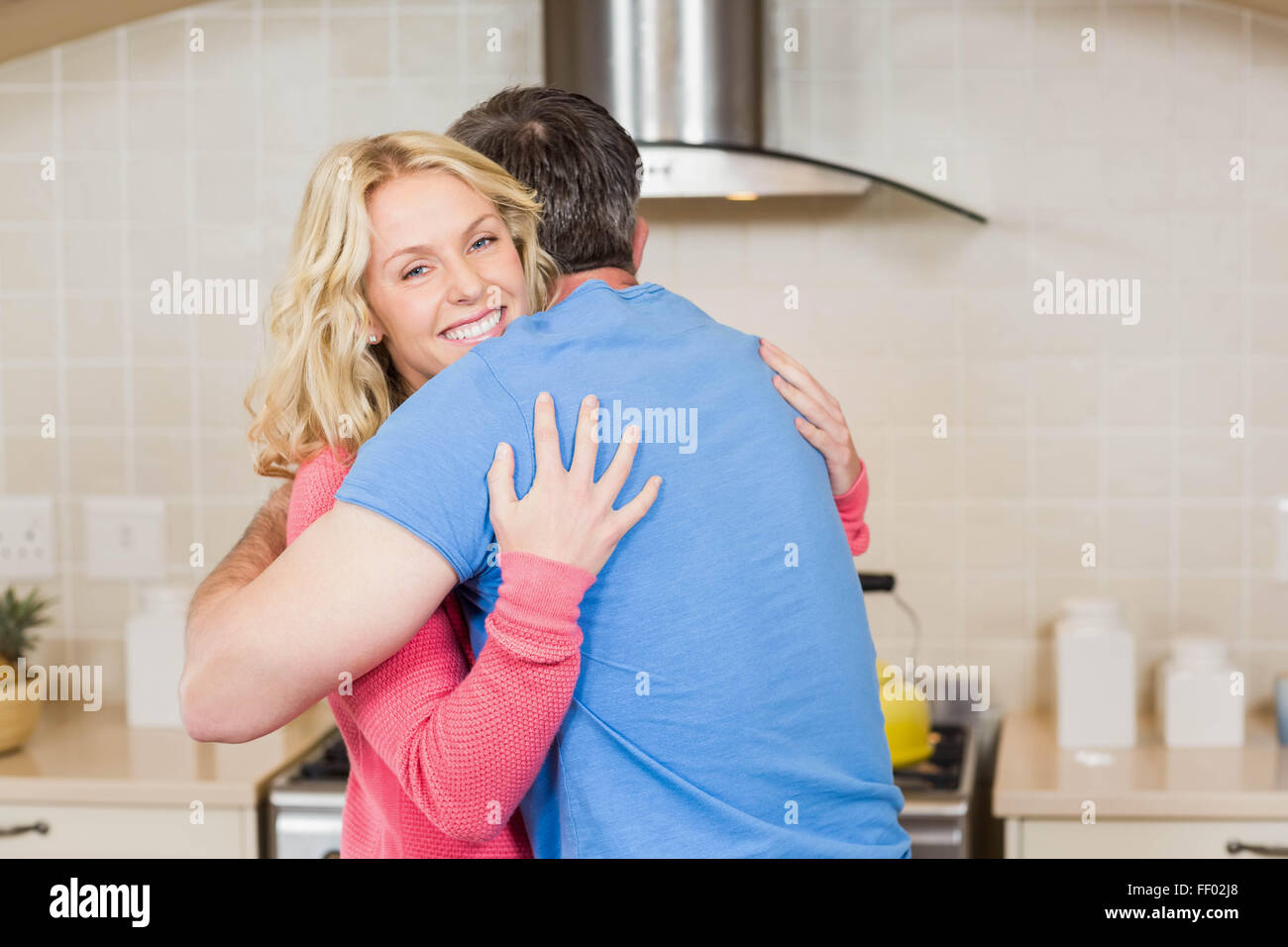 Happy couple hugging Stock Photo - Alamy