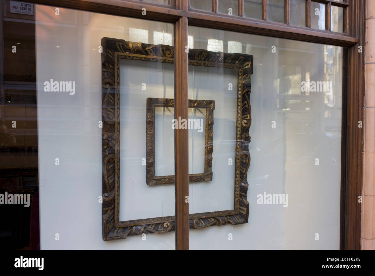 Square shaped picture frames in the window of an art gallery in St ...