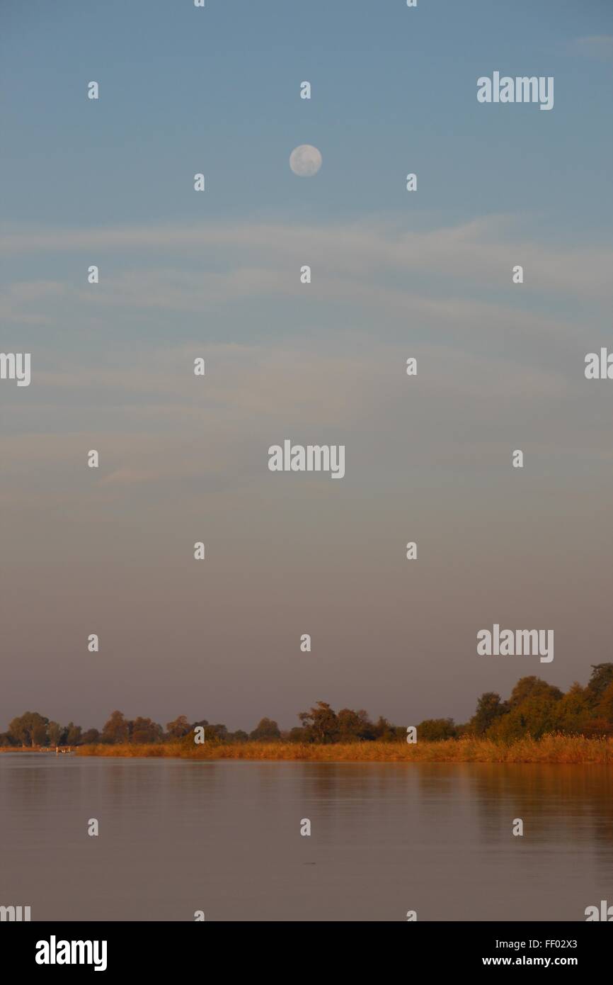 Moon over a river in africa Stock Photo - Alamy