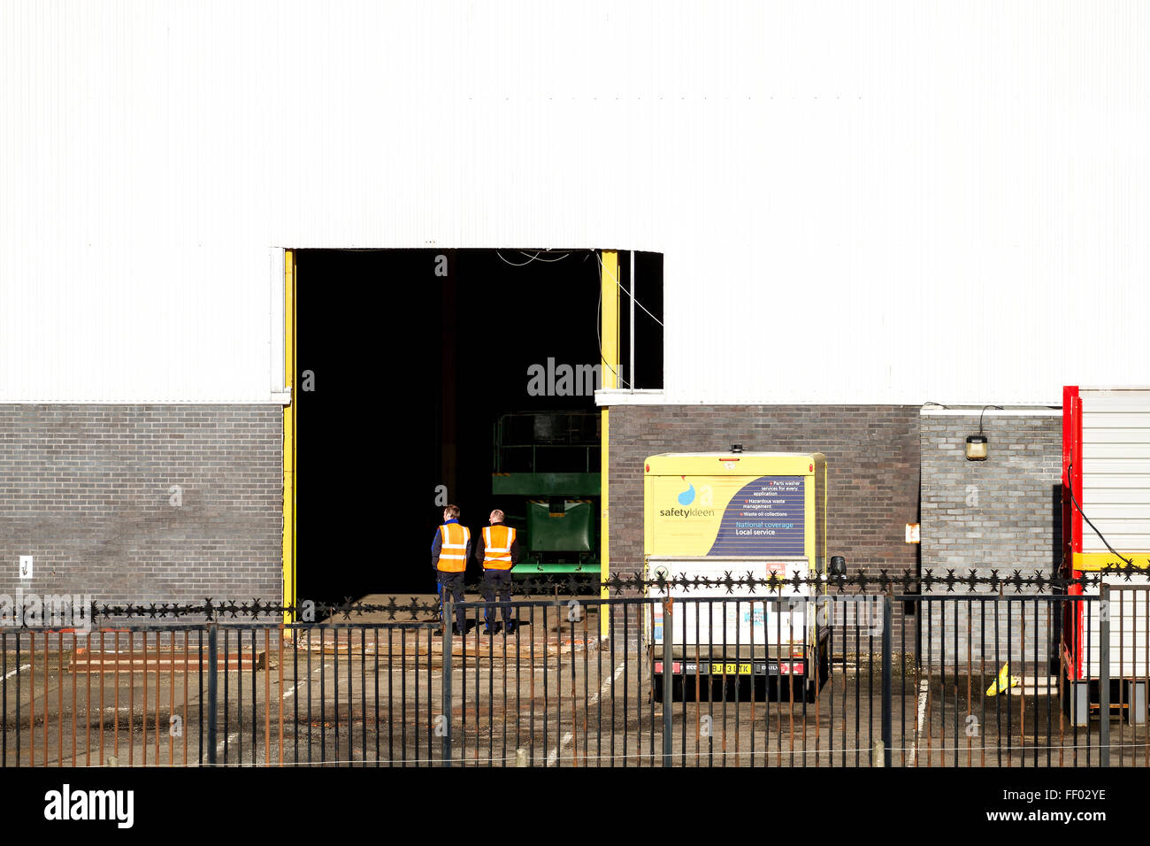 PressureFab fabrication company workmen standing at the entrance of ...