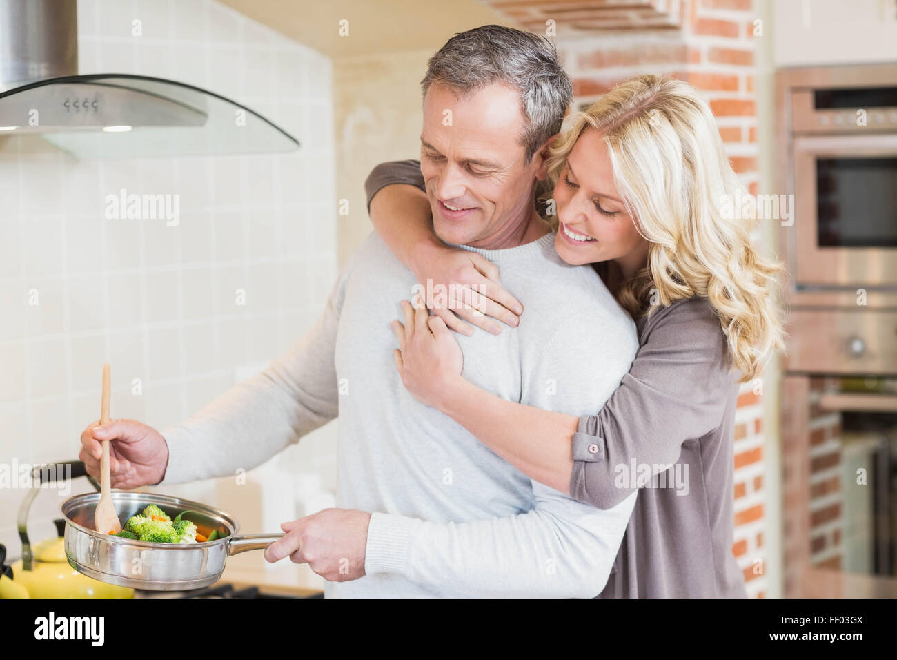 Cute couple cooking Stock Photo - Alamy