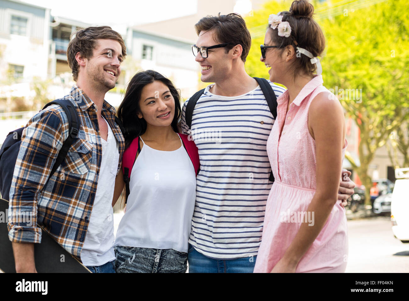 Hip friends talking Stock Photo - Alamy