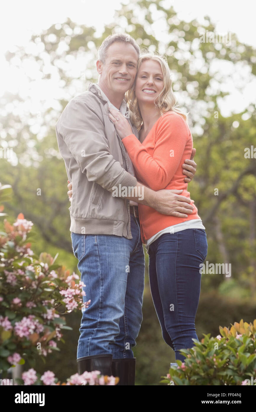 Portrait happy couple hugging hi-res stock photography and images - Alamy