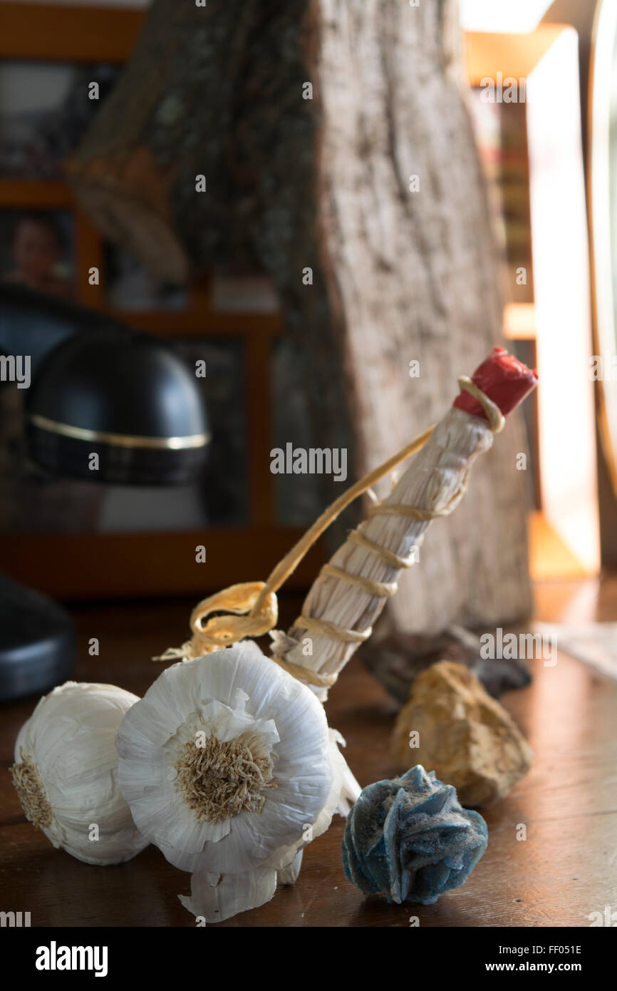 garlic string photographed with natural light on a wooden commode Stock ...