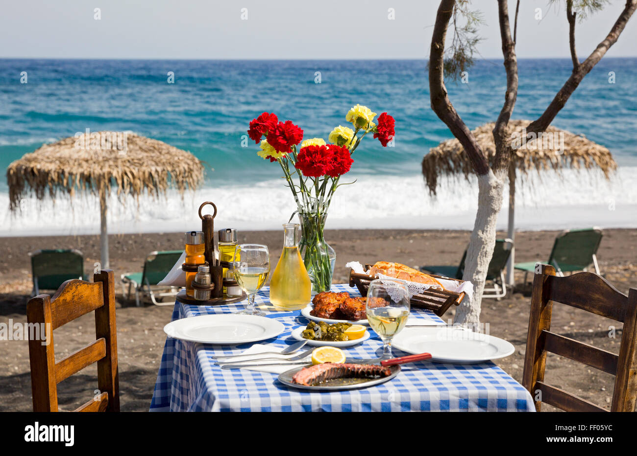 Beautiful romantic table on the beach near the sea Stock Photo - Alamy