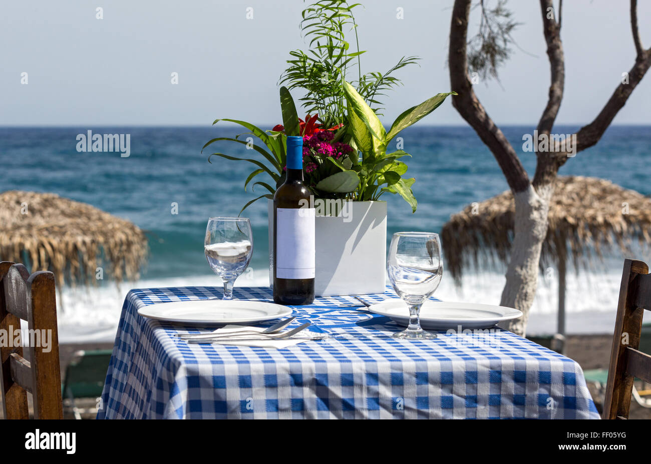 Beautiful romantic table on the beach near the sea Stock Photo - Alamy