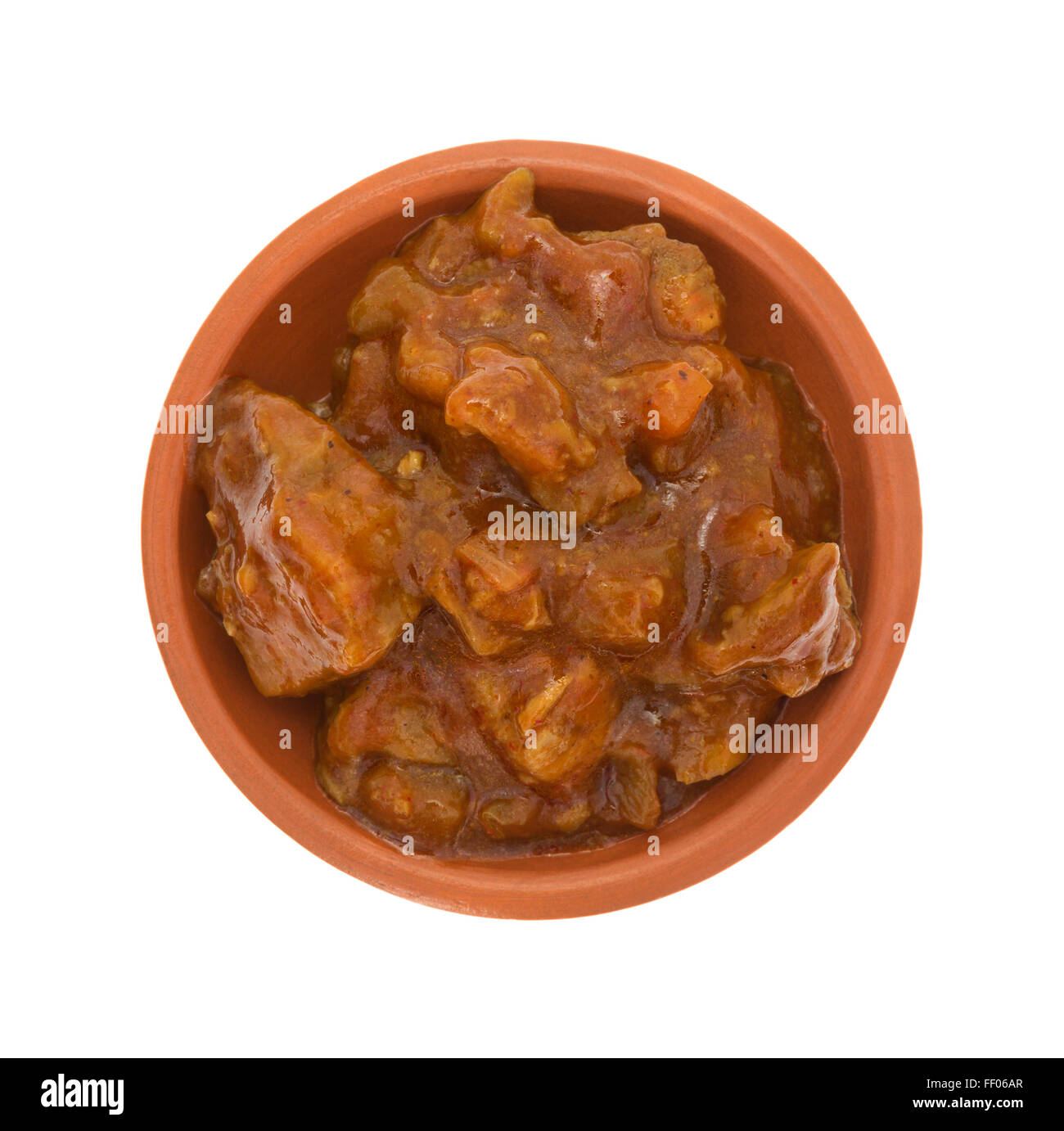 Top view of a small serving of braised beef plus gravy in a small bowl ...