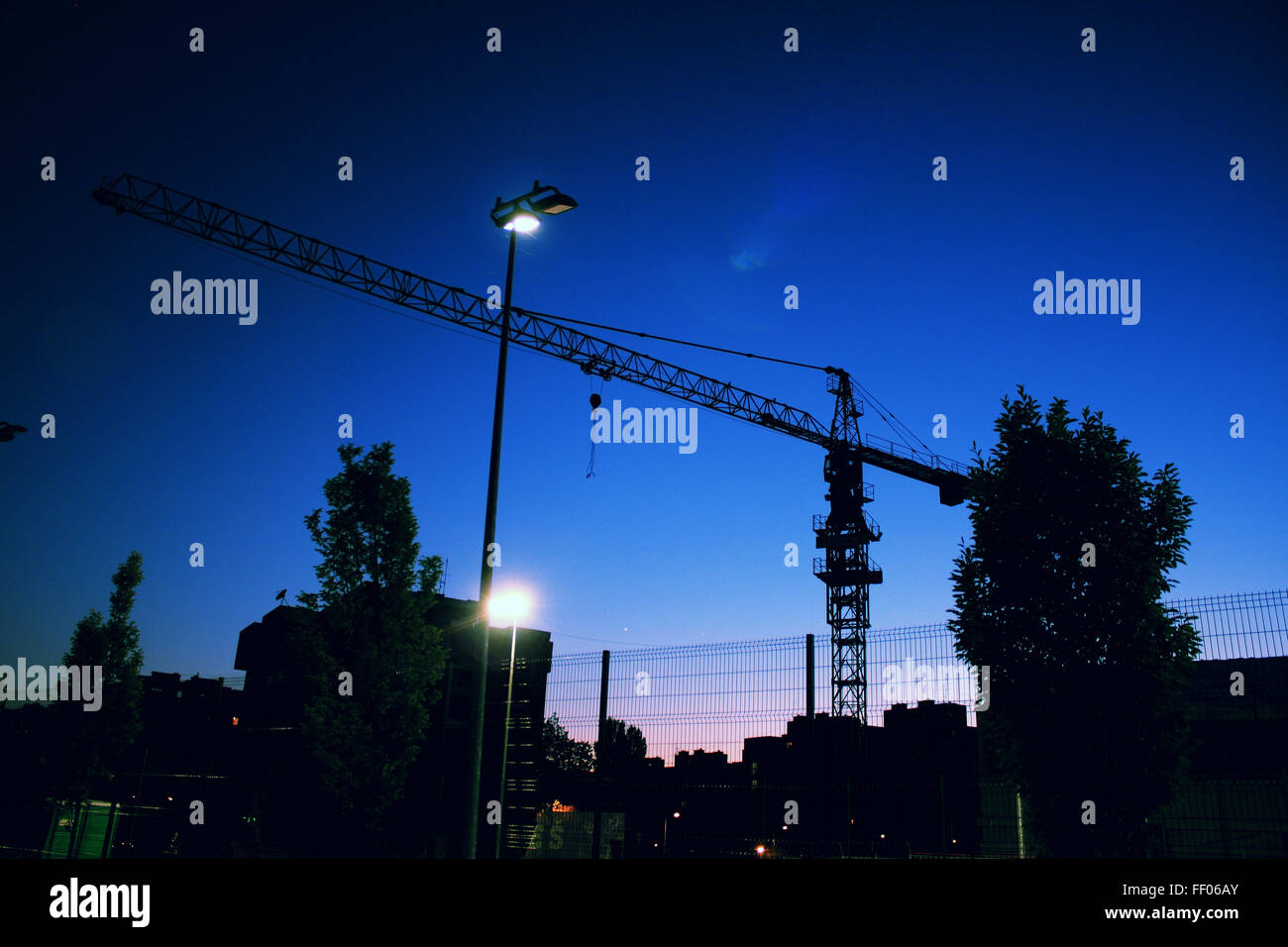 The crane work at night Stock Photo - Alamy