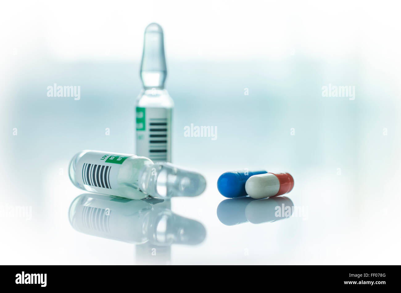 Glass vials and tablets Stock Photo - Alamy