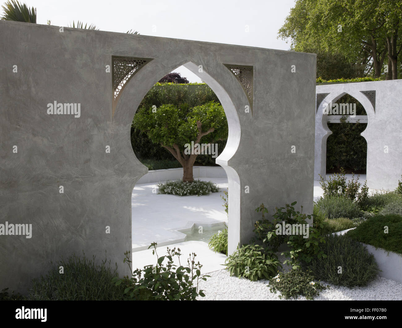 An Islamic architecture courtyard garden with stone paving gravel and ...