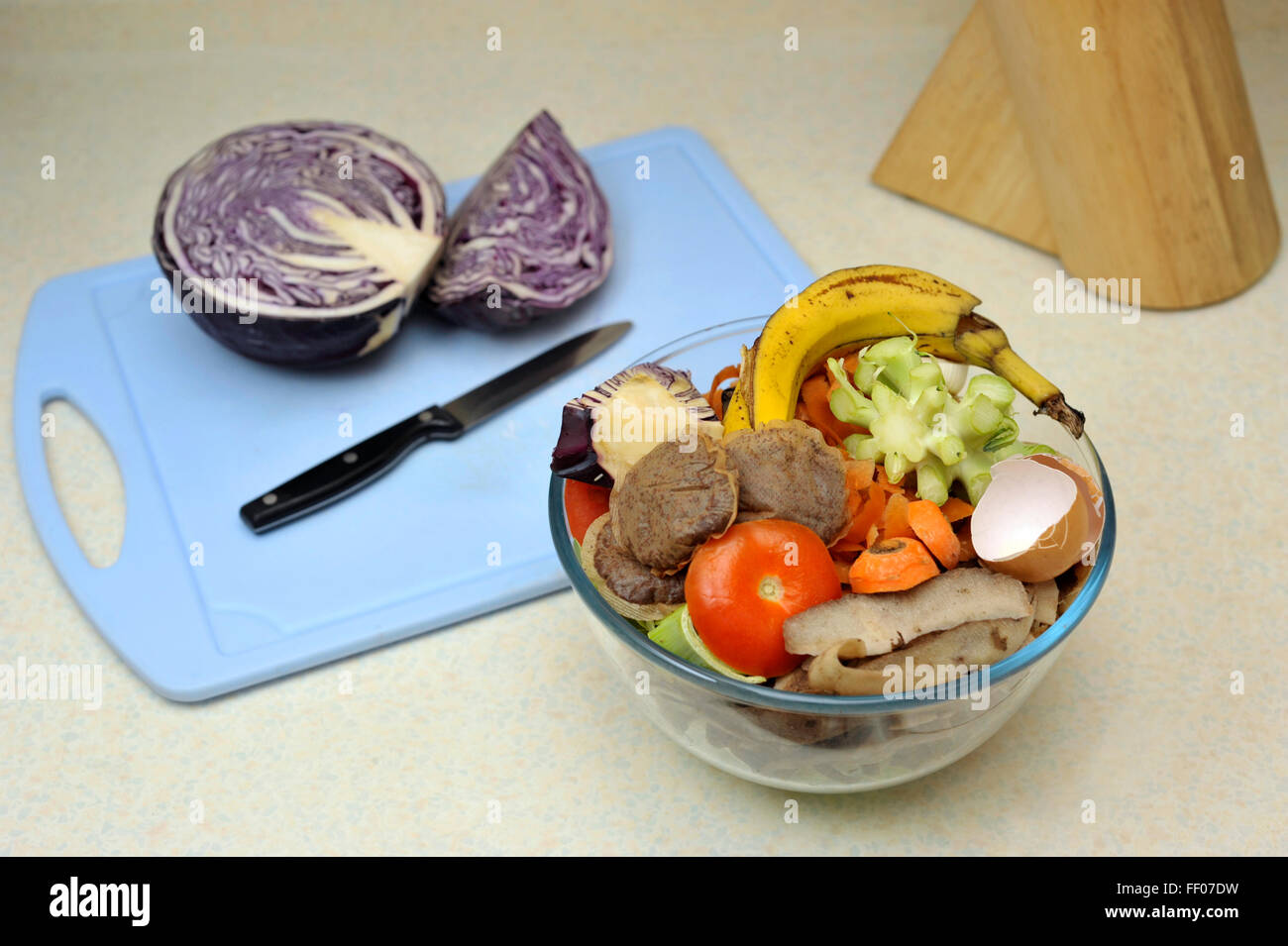 Kitchen raw food and vegetable waste collected for composting, beside ...