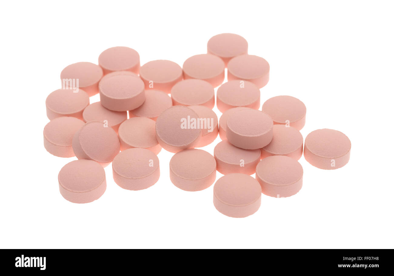 A group of pink famotidine tablets isolated on a white background Stock ...