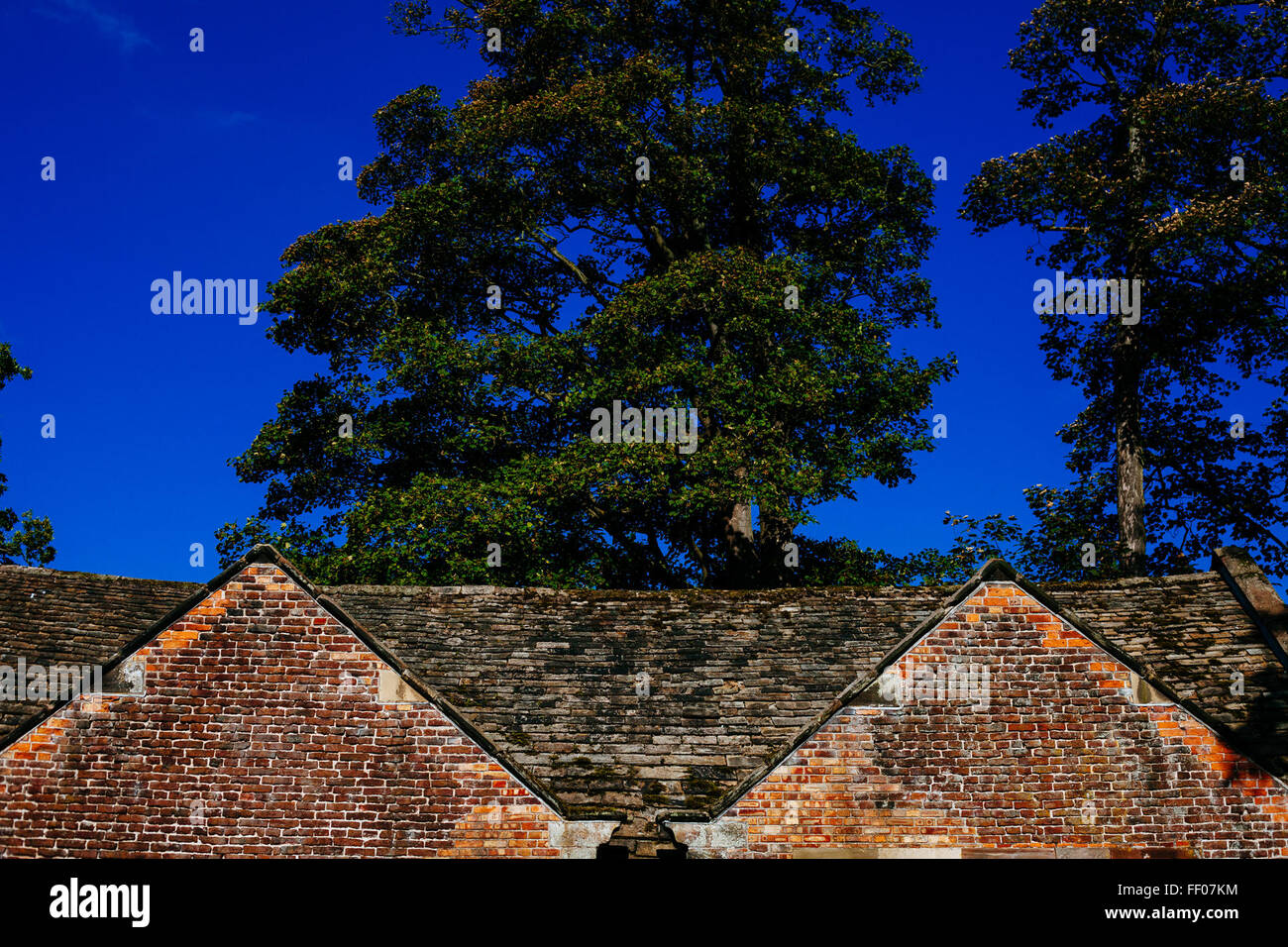 The roof of a traditional windmill, with a blue sky backdrop and a ...
