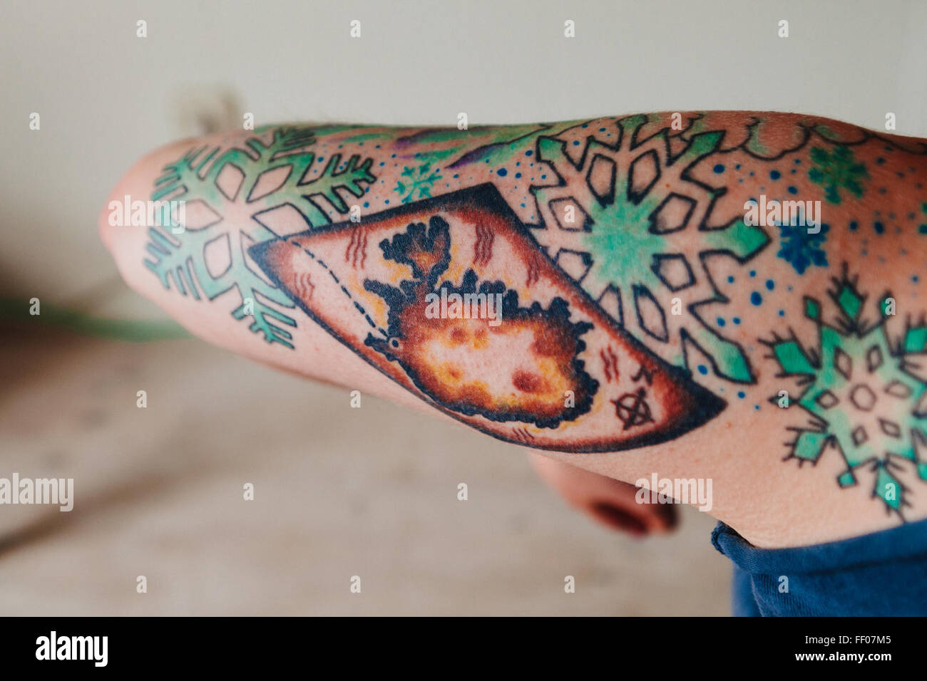 An intricate tattoo design features an island silhouette with a ...