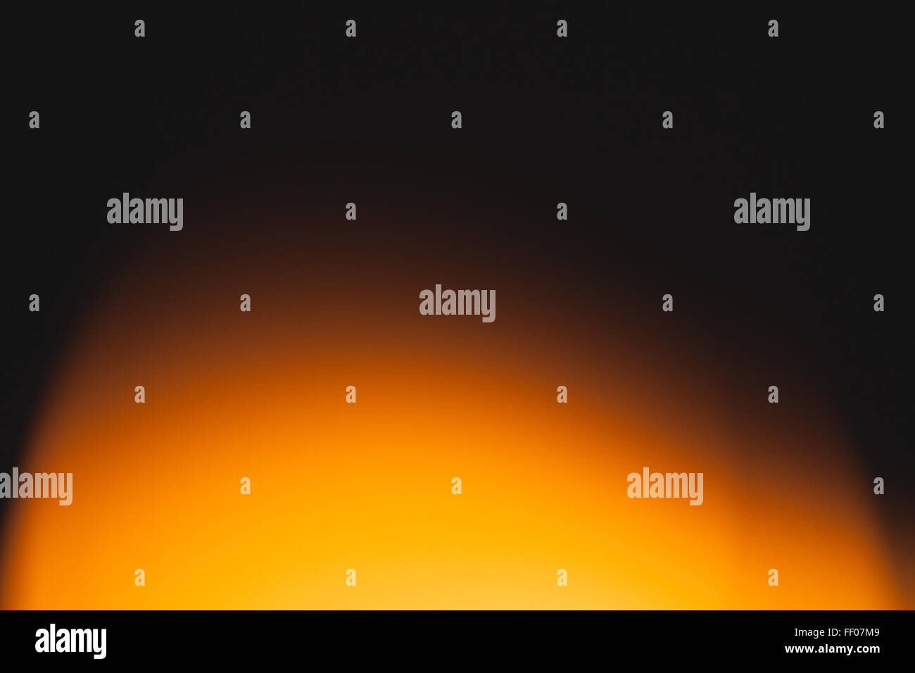 An orange gradient background showcasing a smooth transition from dark ...
