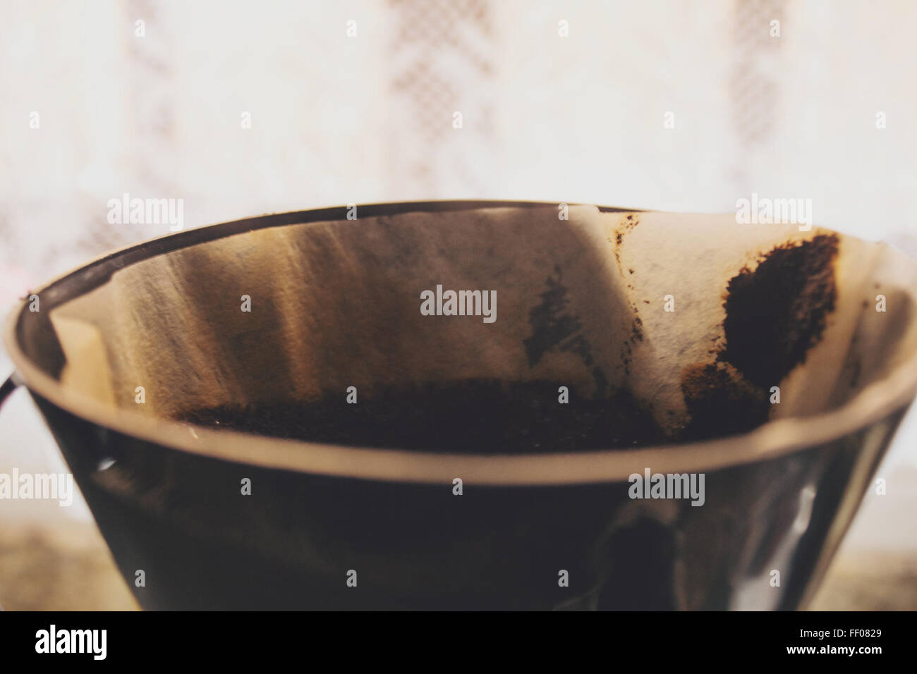 A coffee filter designed to separate grounds from brewed coffee. The ...