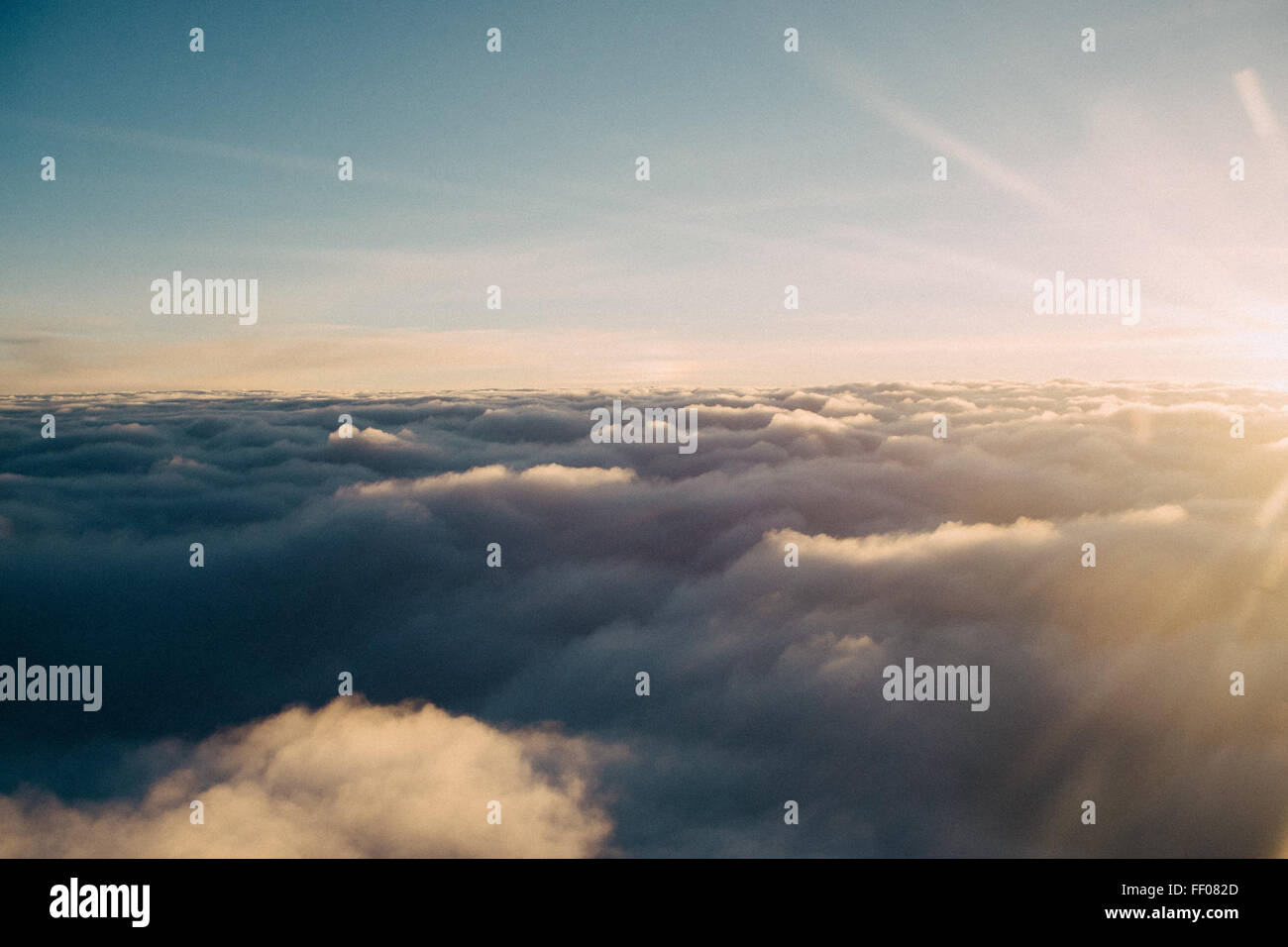 A breathtaking view from above the clouds, showing the horizon and ...