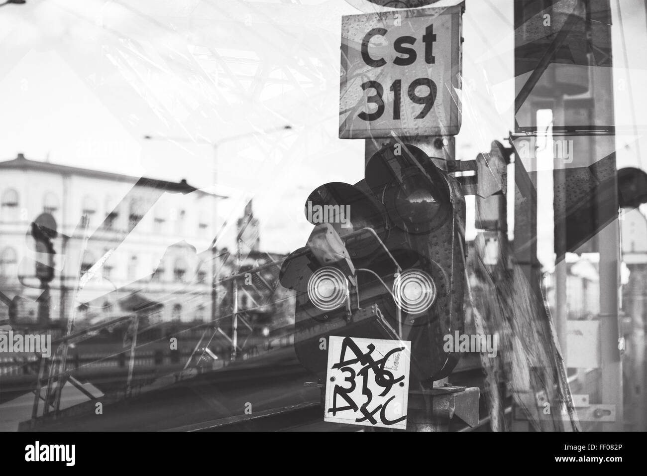A railway crossing with a light and warning sign, designed to alert ...