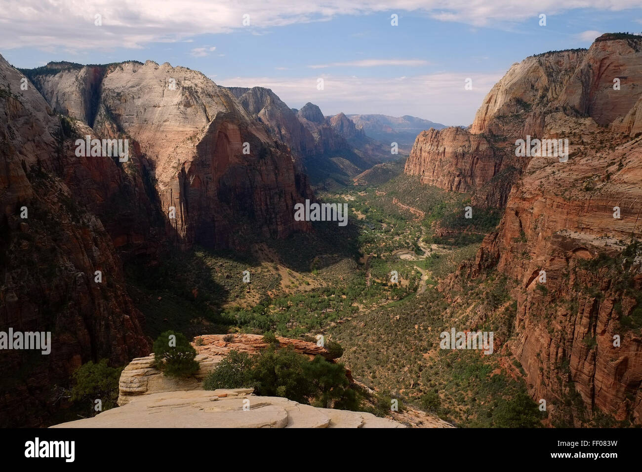 A valley nestled between towering cliffs, offering a stunning view of ...