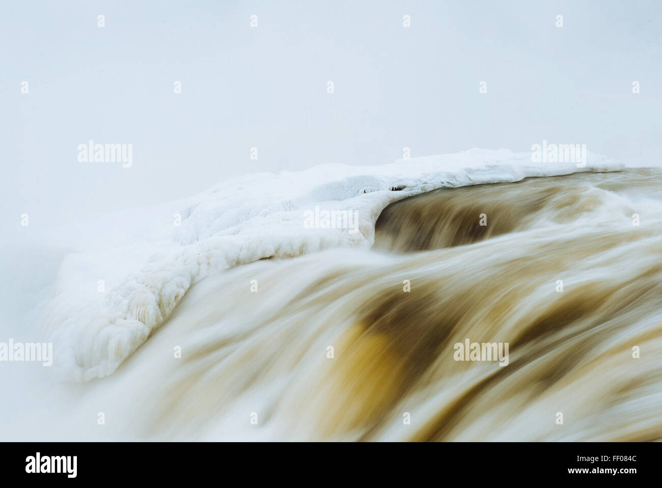 A time-lapse of a stream running through a winter landscape, with ice ...