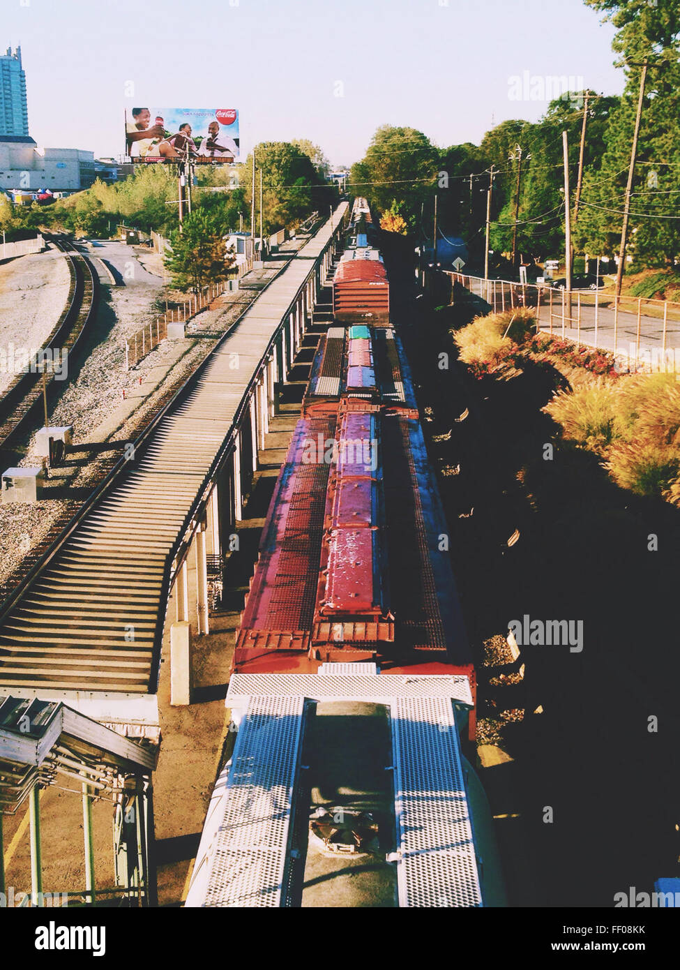 An urban train travels along its track, a crucial part of public ...