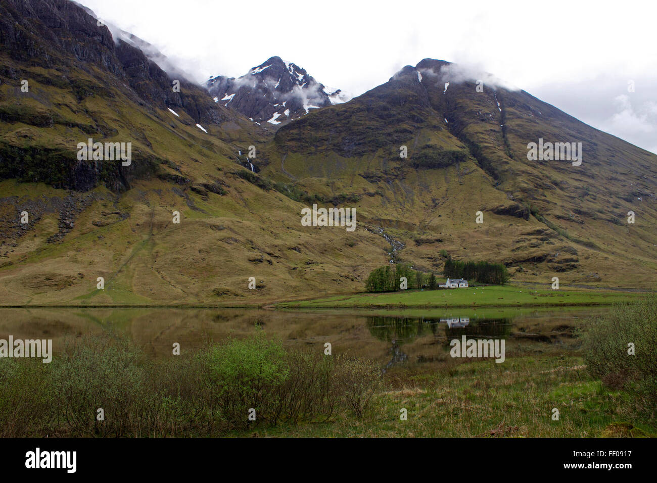 House at Base of Mountain House at Base of Mountain Stock Photo - Alamy