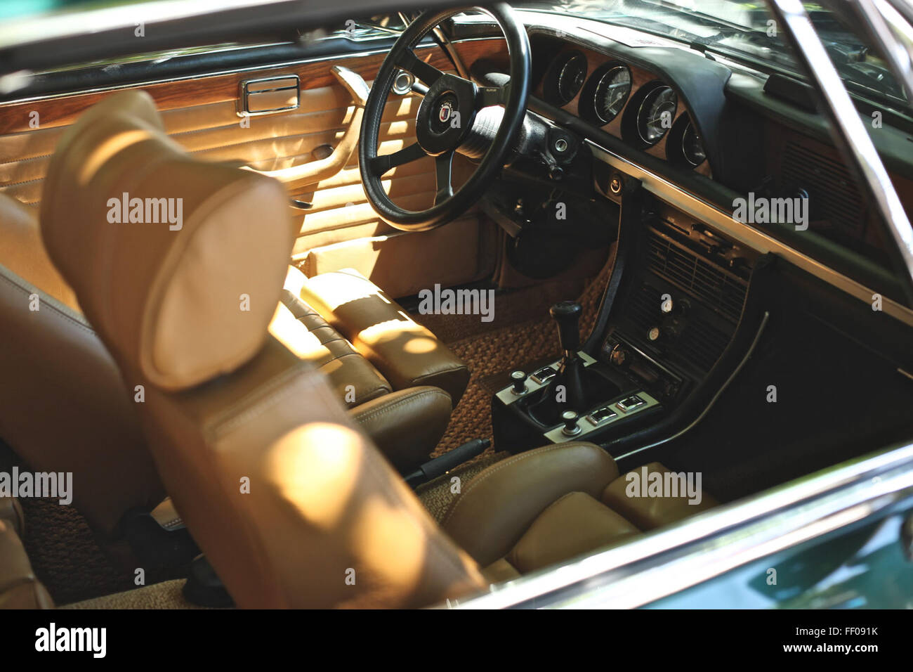 The interior of an automobile, featuring a car dashboard, steering ...