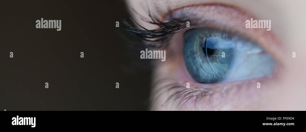 A close-up image of a clear human eye, showcasing the iris, pupil, and ...