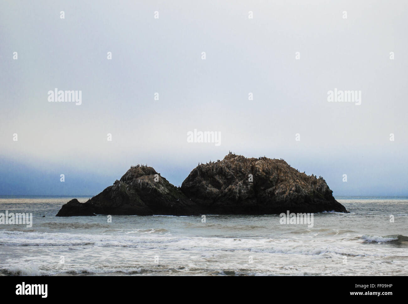 Outcrop in Ocean near Beach Outcrop in Ocean near Beach Stock Photo - Alamy