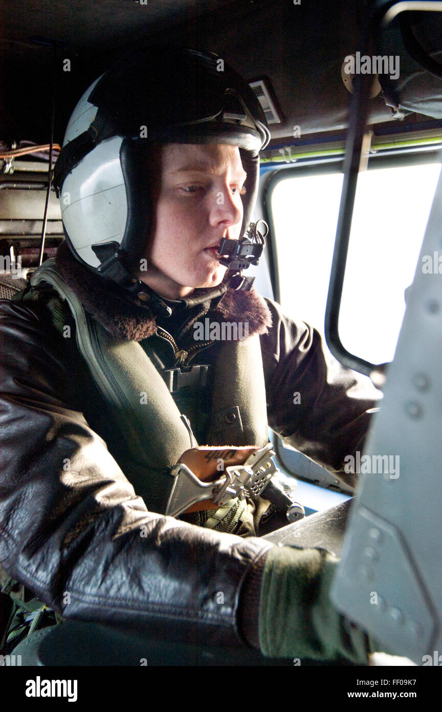 US Navy helicopter aircrewman in the rear cabin of a Seahawk Stock ...