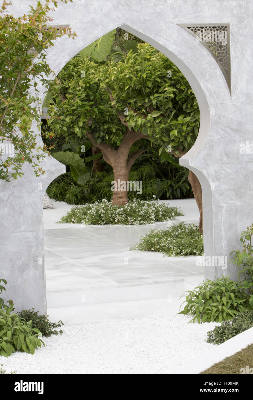 An Islamic architecture courtyard garden with stone paving gravel and ...