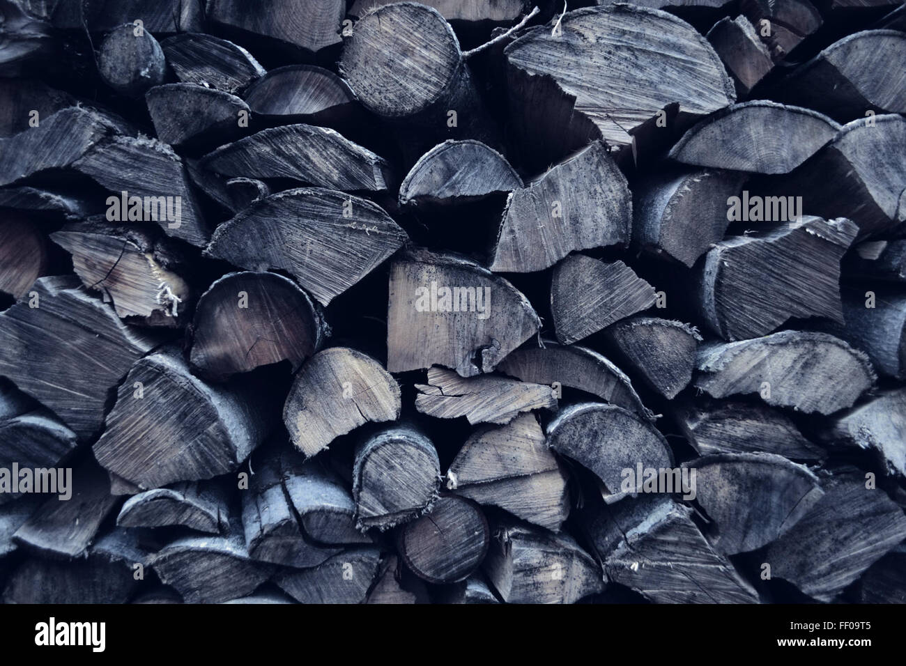 A close-up image of logs stacked in a pattern, showcasing the texture ...