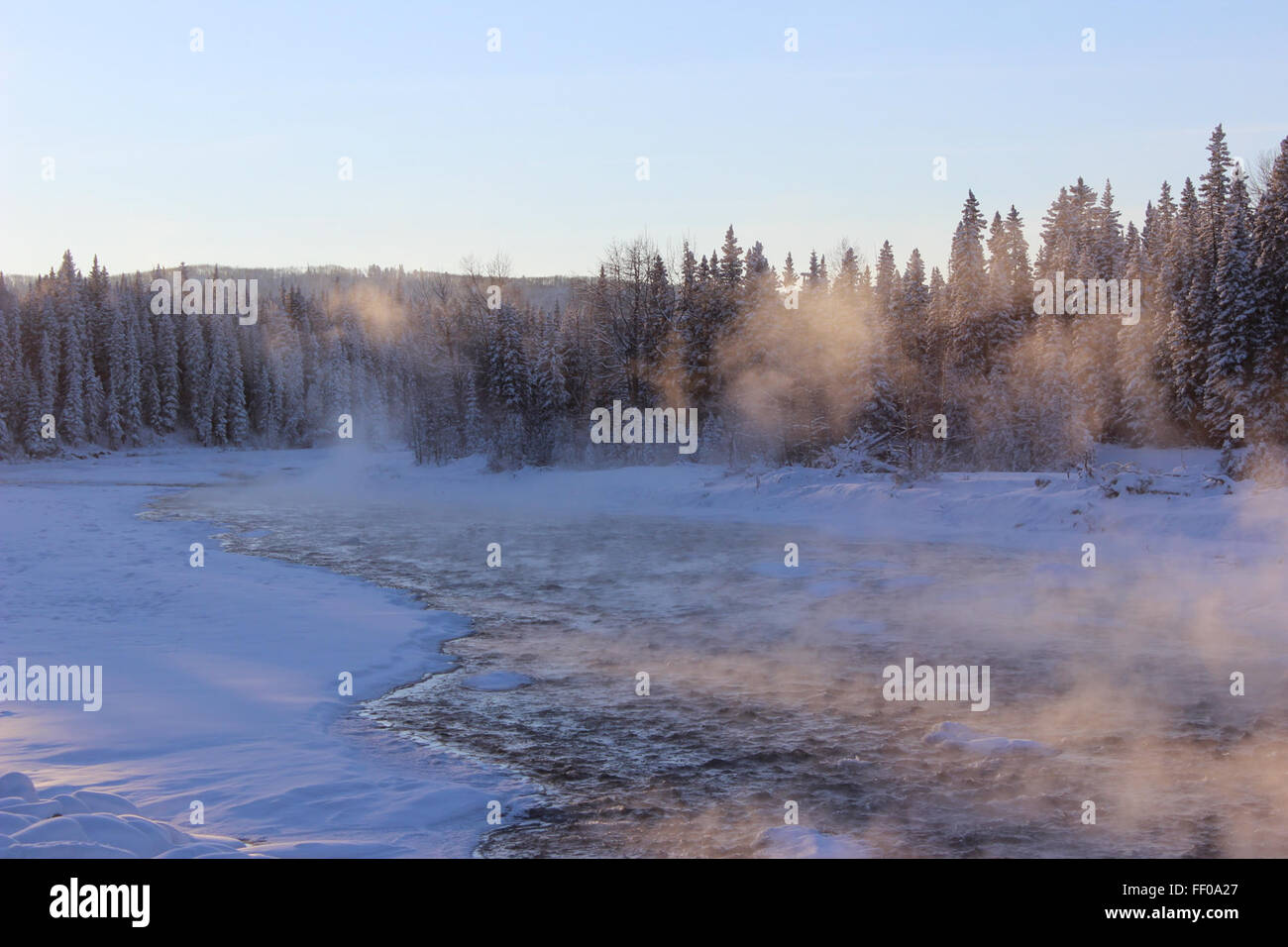 A misty scene over an icy lake, with fog enveloping the landscape and ...