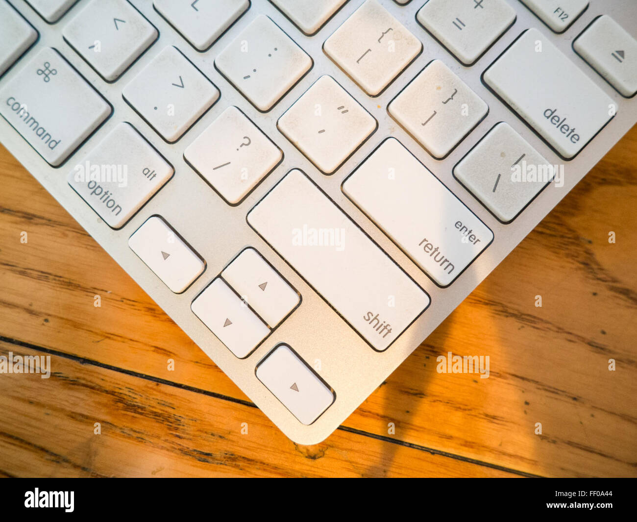 A grey keyboard with flat keys, designed for a streamlined, modern ...