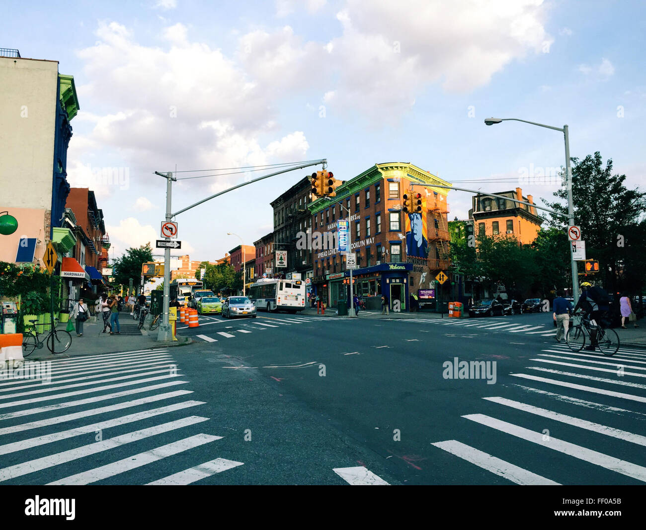 A bustling urban intersection with cyclists, pedestrians, and ...