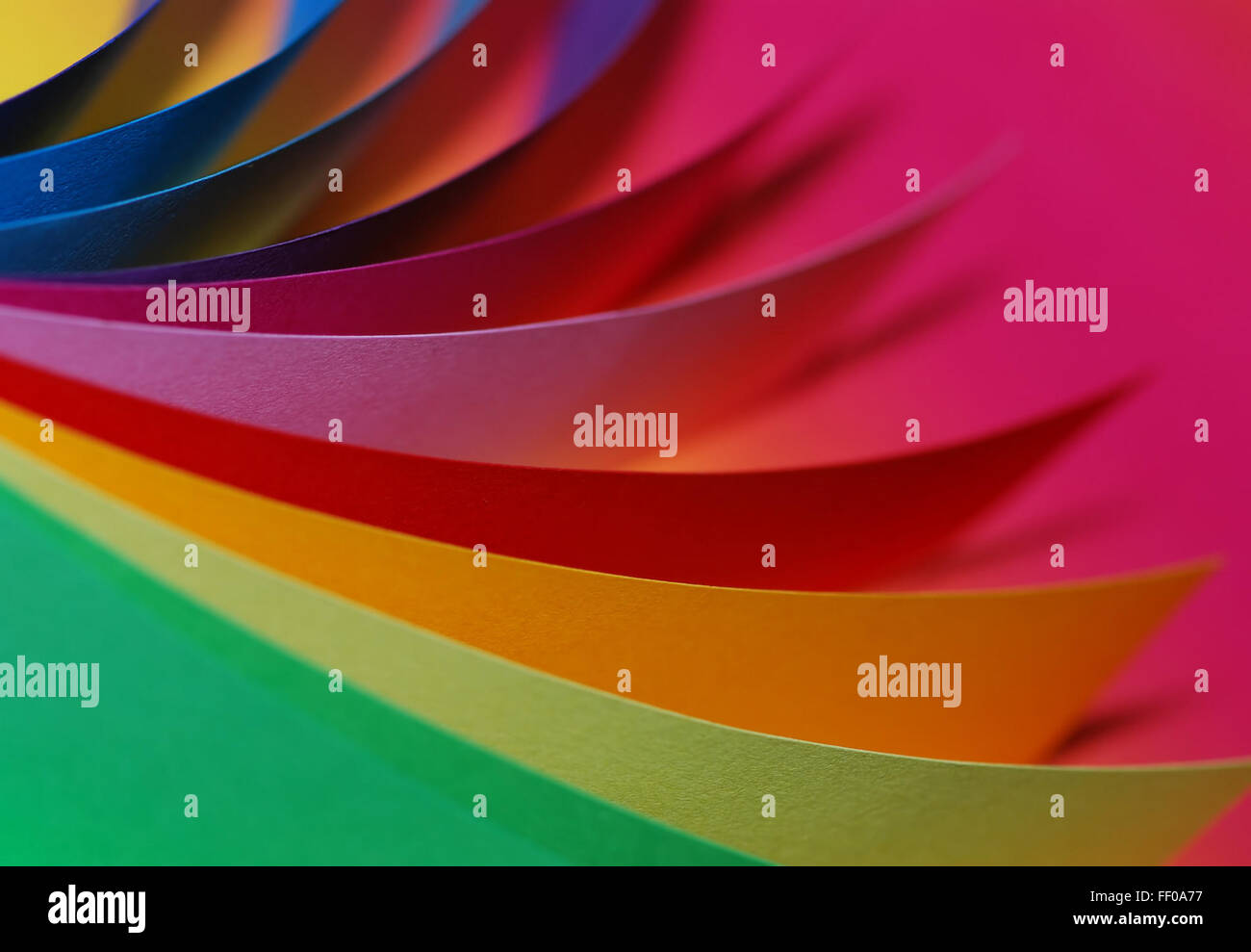 A stack of colorful construction paper in various shades, commonly used ...