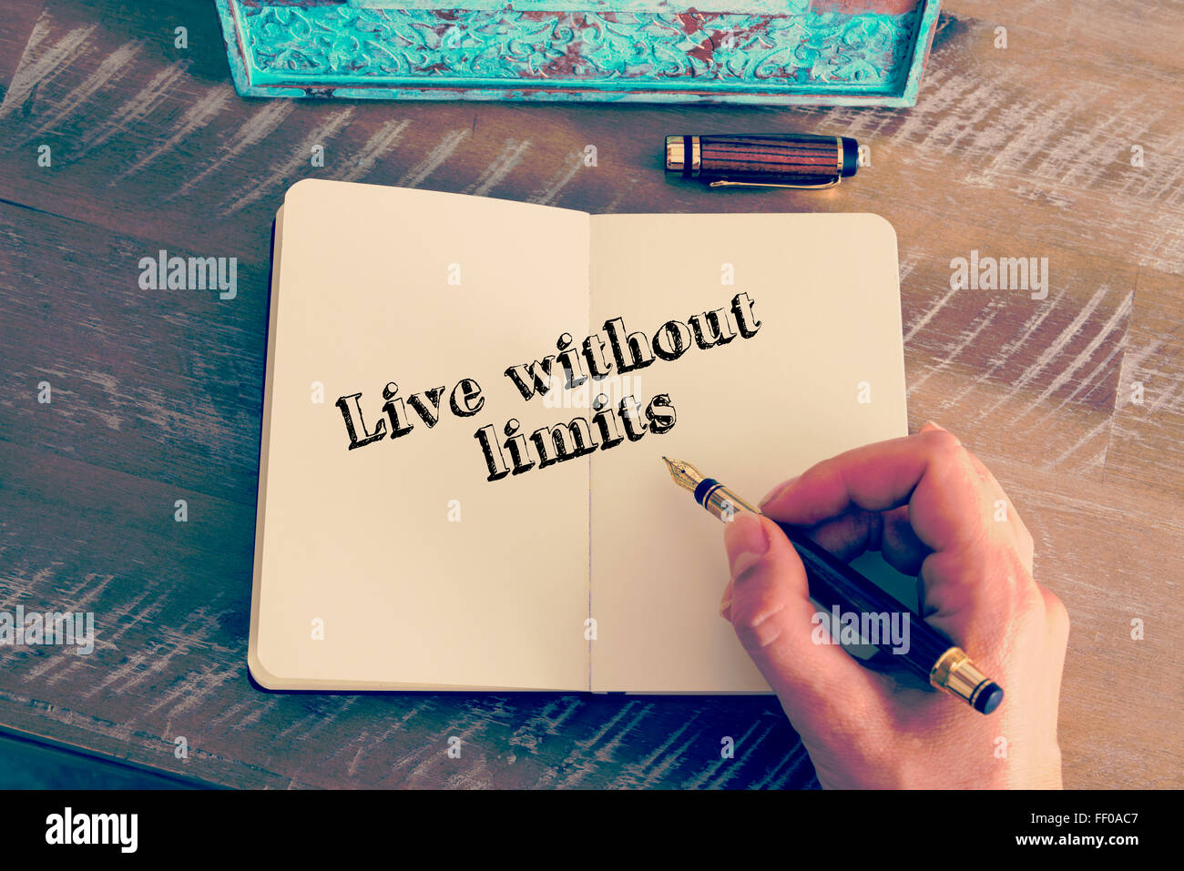 Retro effect and toned image of a woman hand writing a note with a ...