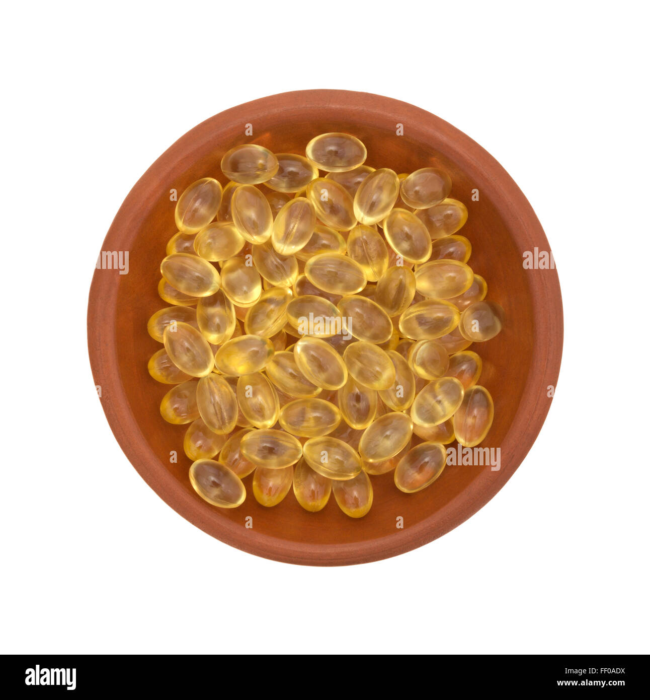 Top view of a bowl of garlic capsules isolated on a white background ...