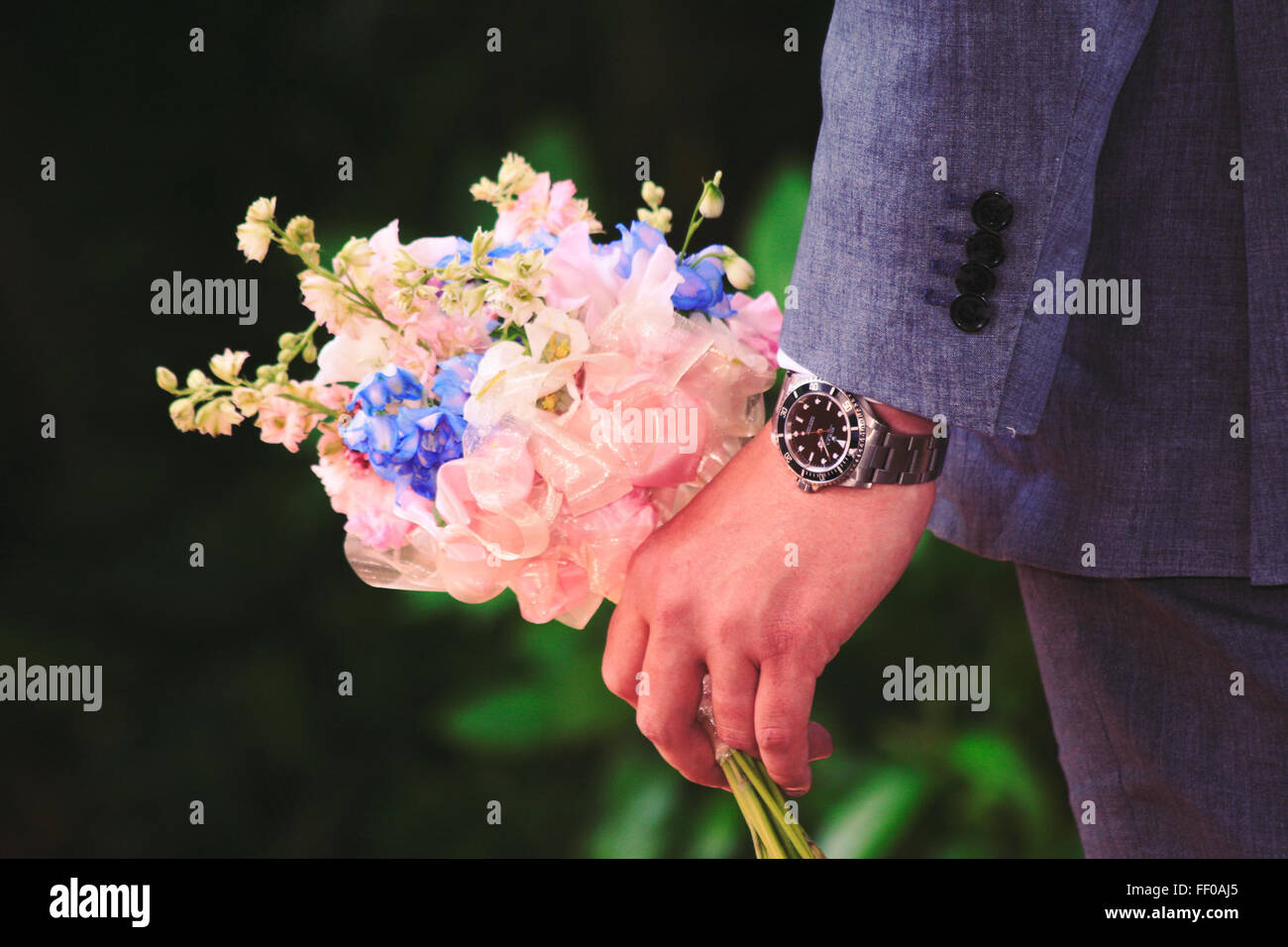 Hand Holding Bouquet of Flower Stock Photo - Alamy