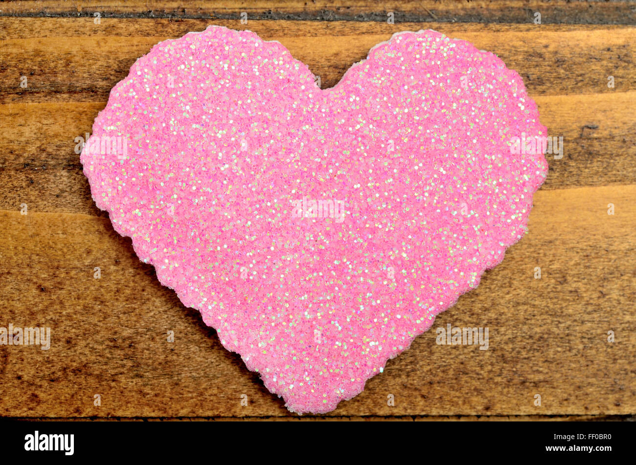 Pink heart on wooden table Stock Photo - Alamy