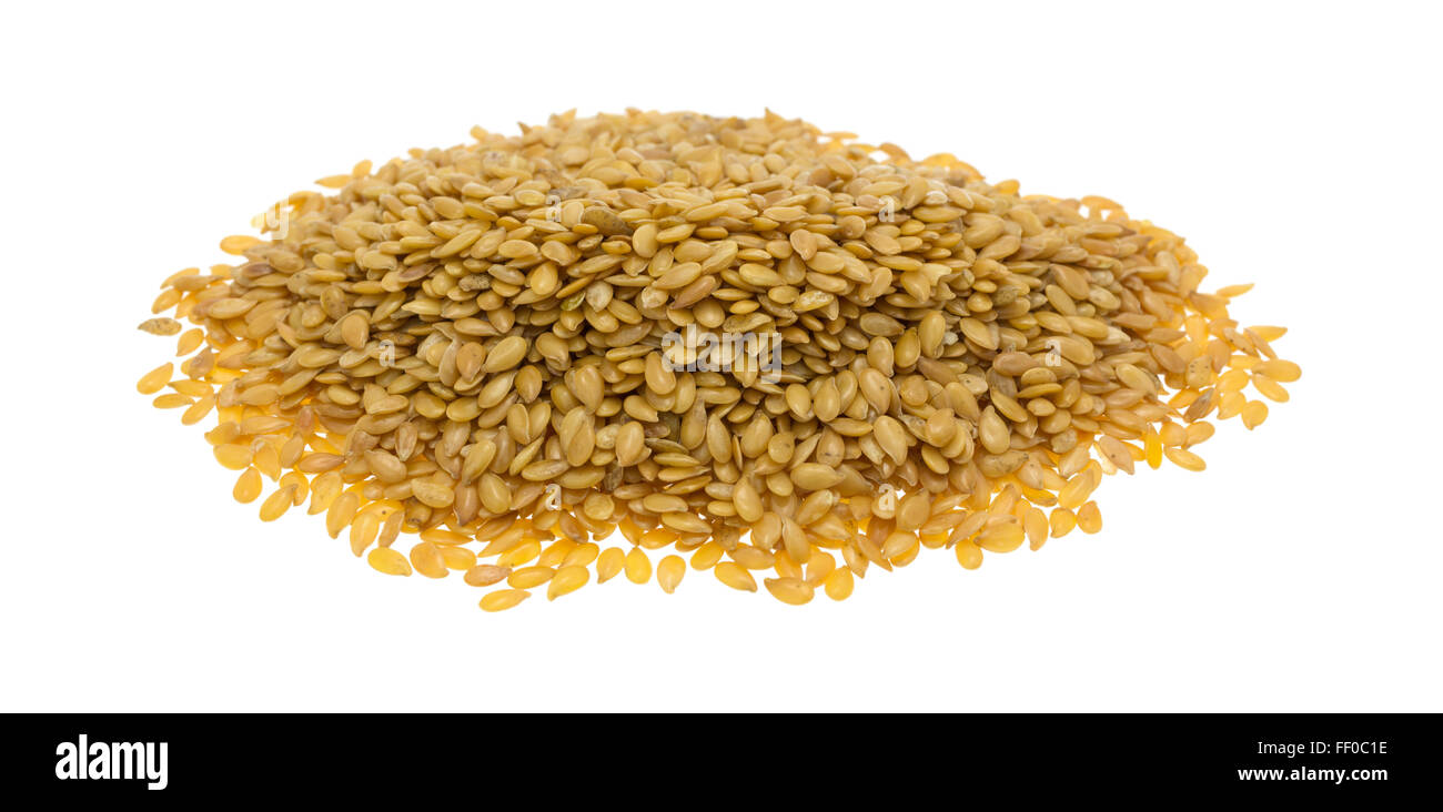 Side view of a small portion of organic golden flaxseed isolated on a white background Stock ...