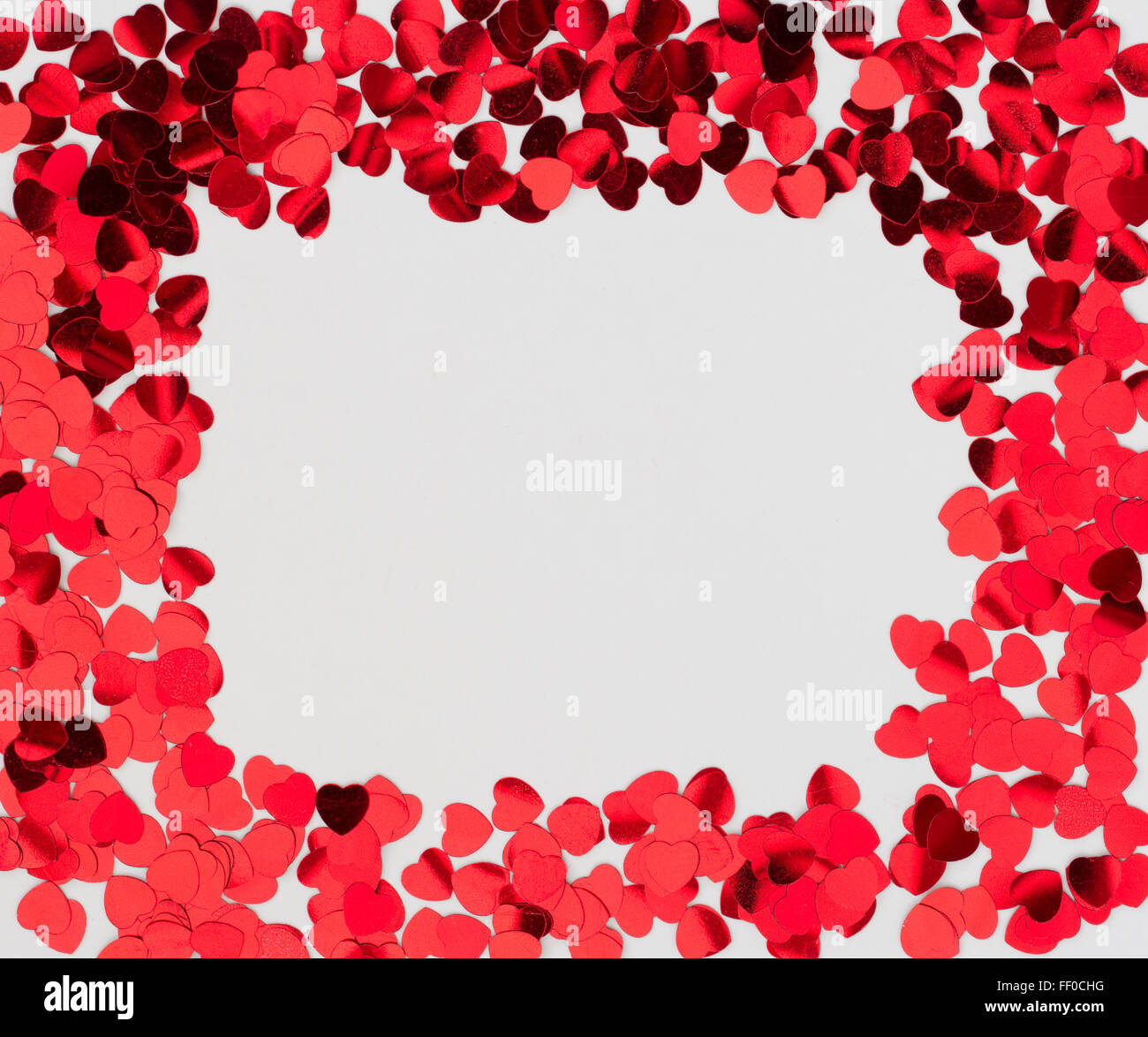 A picture frame made from small love hearts isolated on a white ...