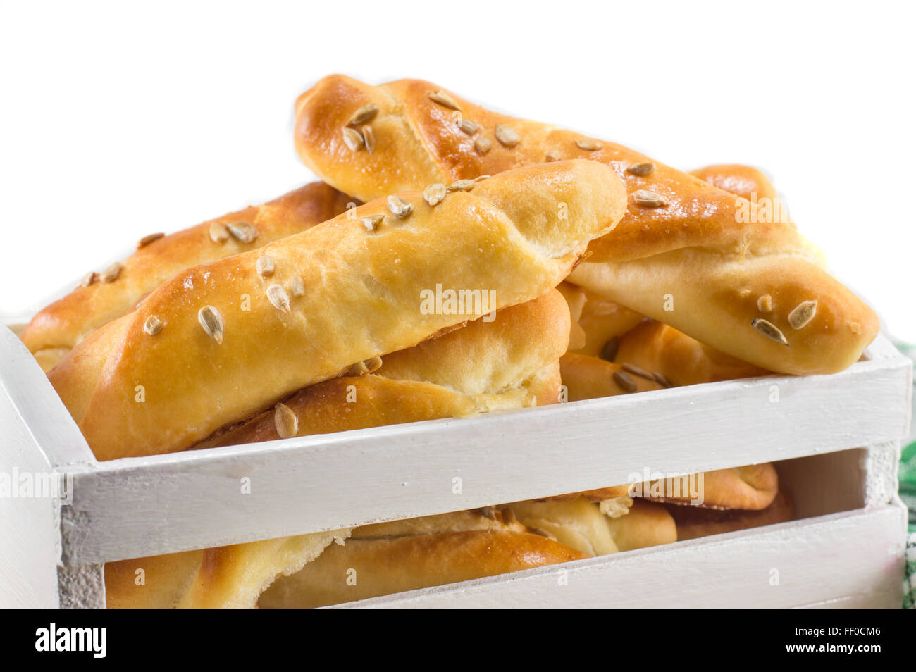 sesame pastry in a white crate isolated Stock Photo - Alamy